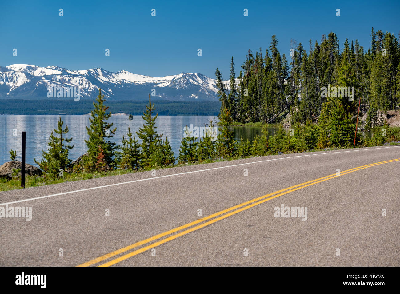 Highway by the lake in Yellowstone Stock Photo - Alamy