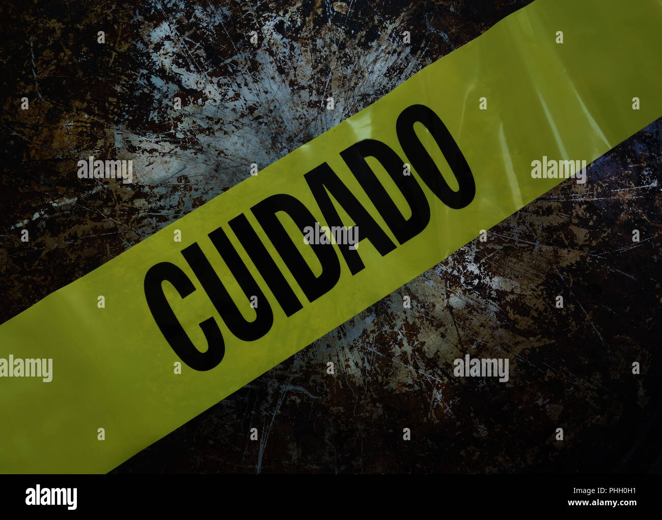 Caution cuidado yellow tape hi-res stock photography and images - Alamy
