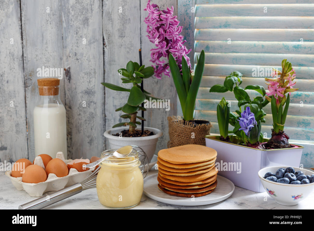 Pancakes on the kitchen table. Breakfast Stock Photo - Alamy