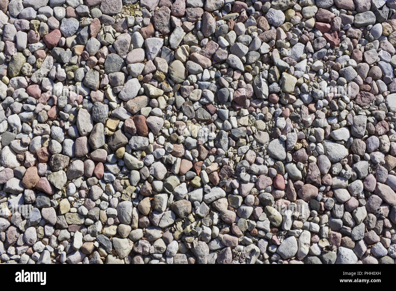 fragment of an ideal sea stone beach Stock Photo - Alamy