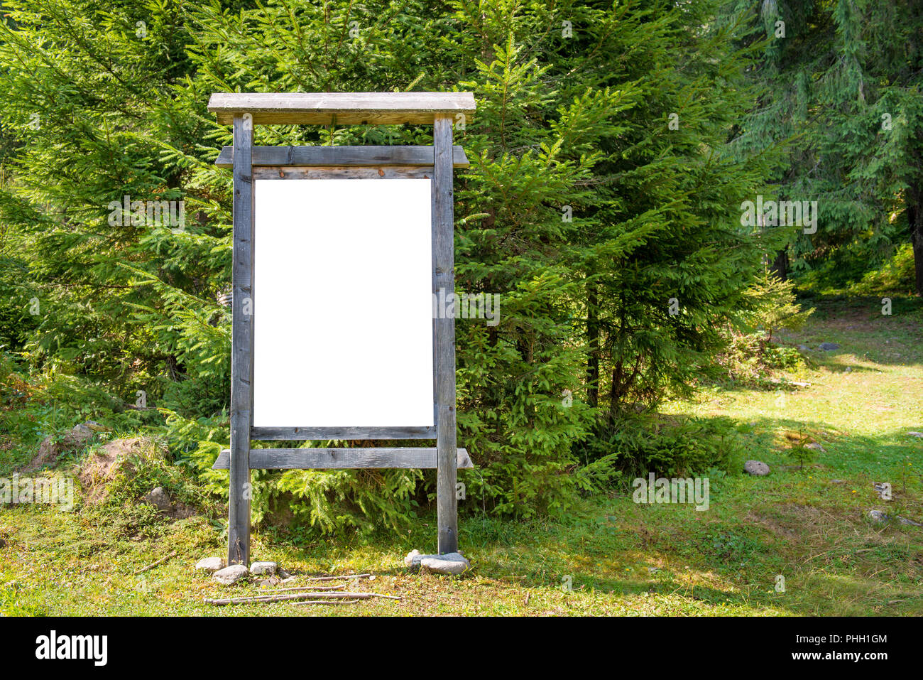 Blank sign board in the park Stock Photo - Alamy