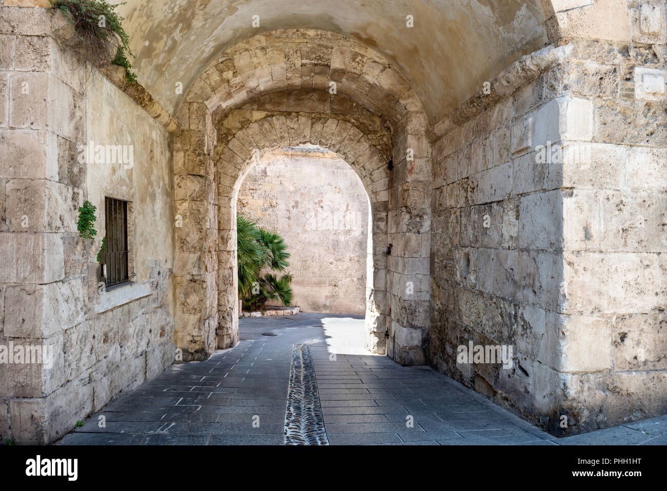 Old stone passage in stone wall Stock Photo - Alamy