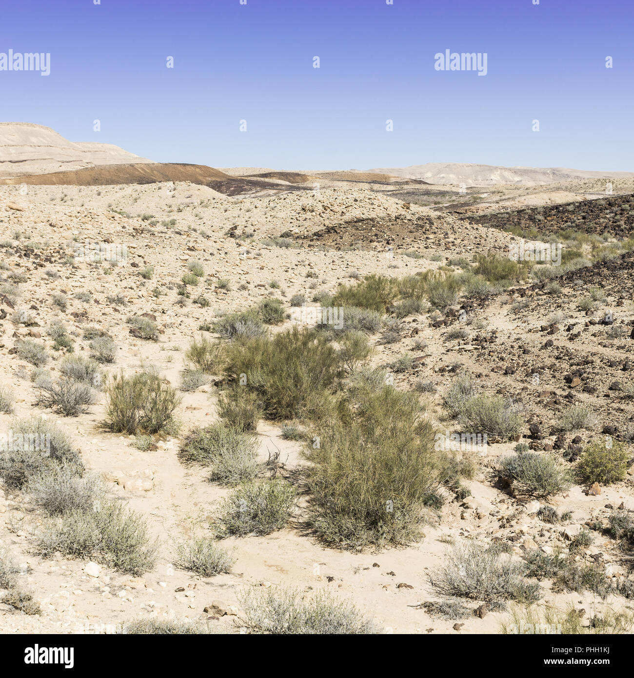 Dusty mountains and deep craters Stock Photo - Alamy