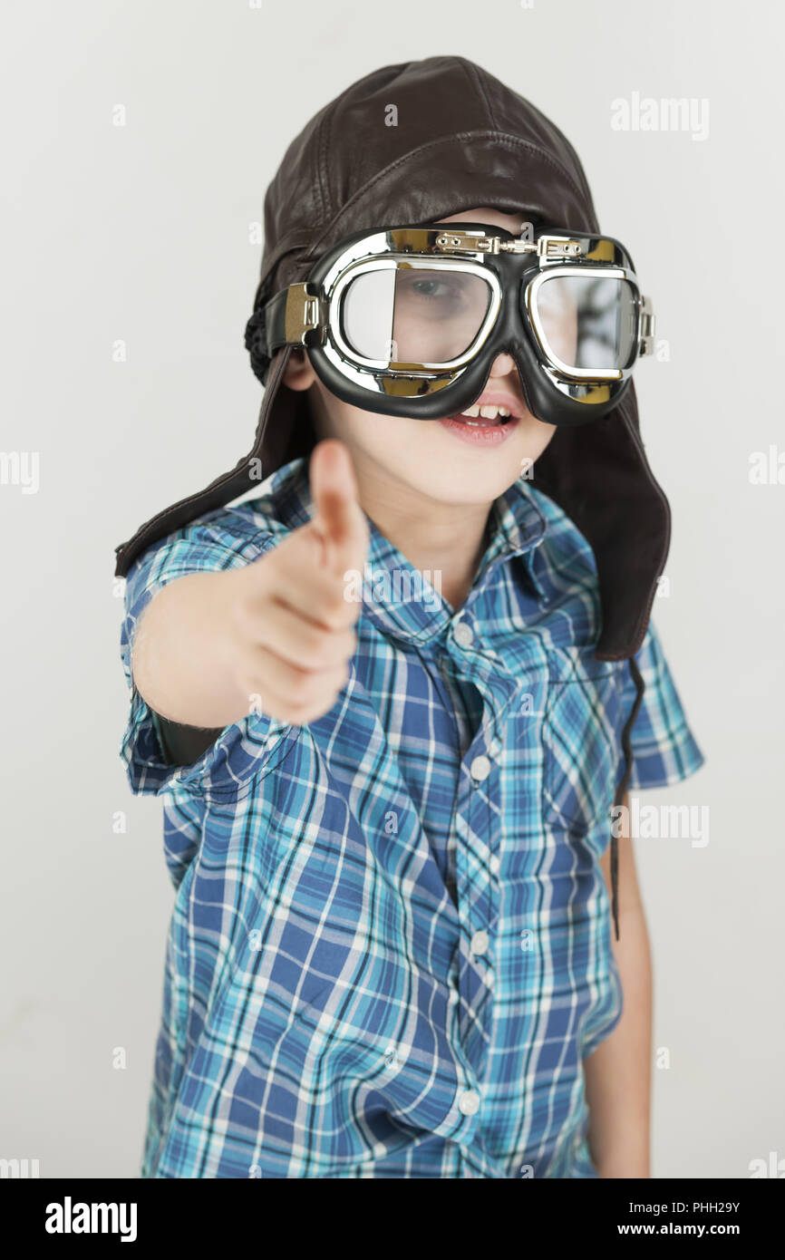 boy thumbs up with leather cap vertical Stock Photo - Alamy