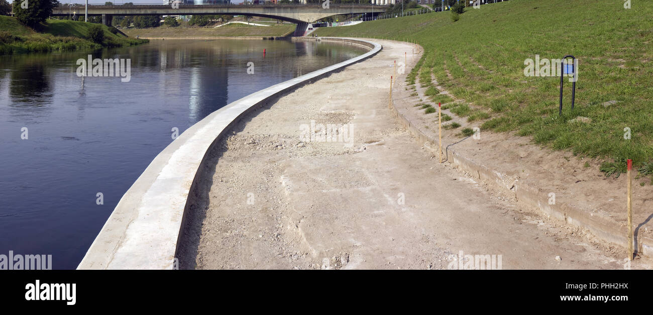 Repair of the old sandy river embankment Stock Photo - Alamy
