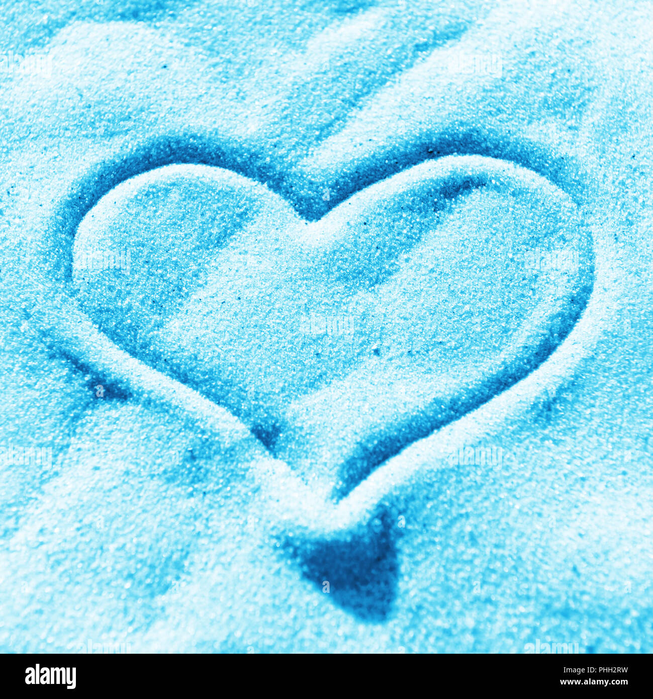 Blue heart on the sand Stock Photo - Alamy