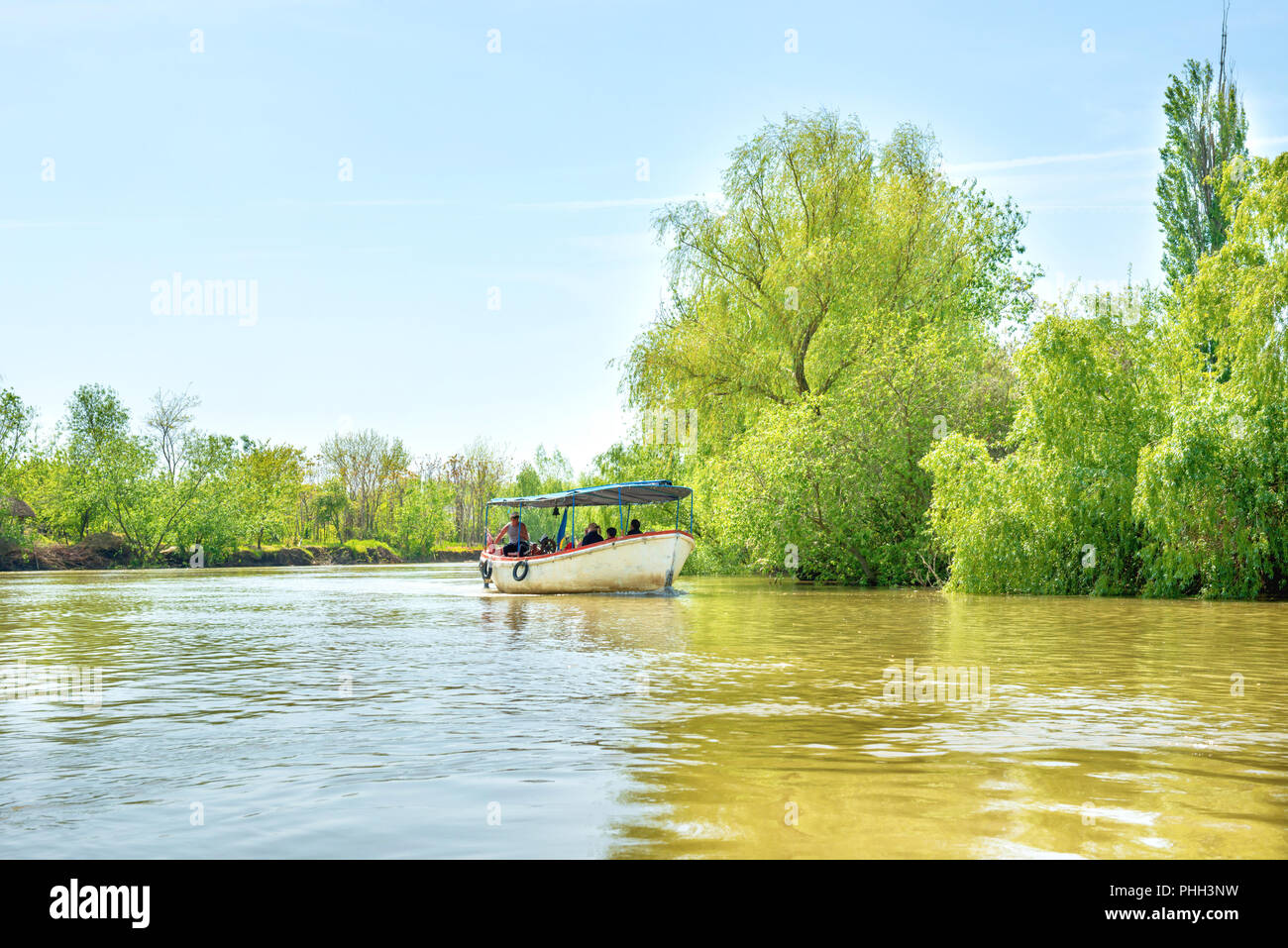 Boat on tropical river Stock Photo - Alamy