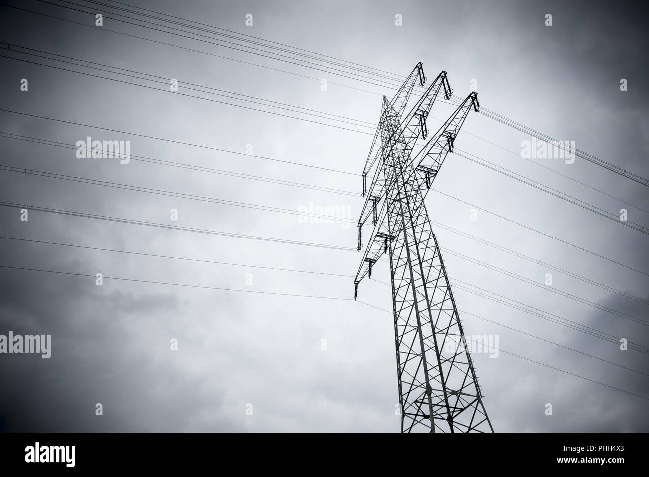Pylon in front of the sky Stock Photo - Alamy