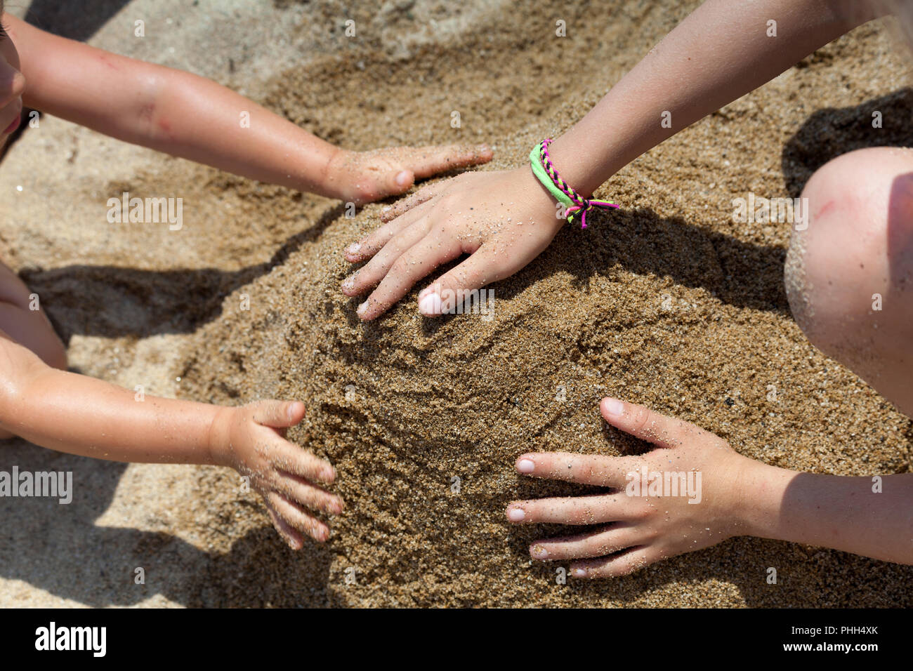 Child hand building sand castle hi-res stock photography and images - Alamy