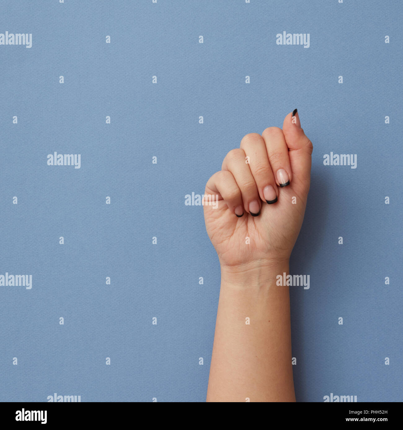 Female hand presenting blue hi-res stock photography and images - Alamy