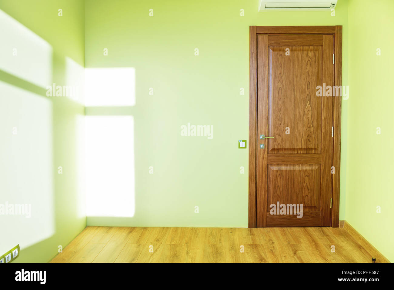 Living room interior of green empty room Stock Photo - Alamy