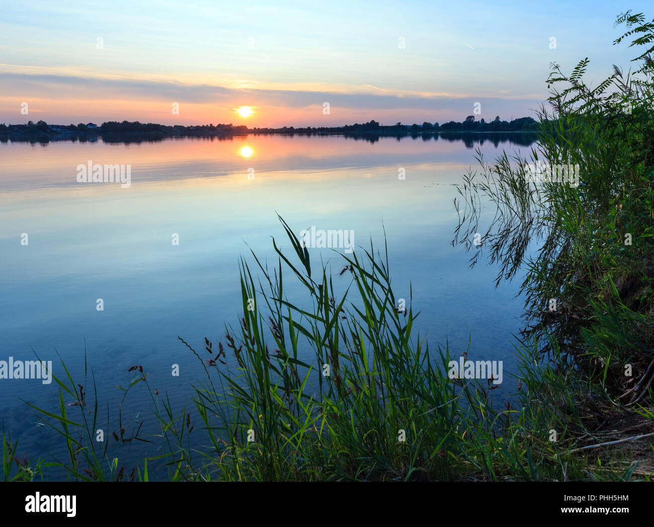 Summer sunset lake calm beach Stock Photo - Alamy