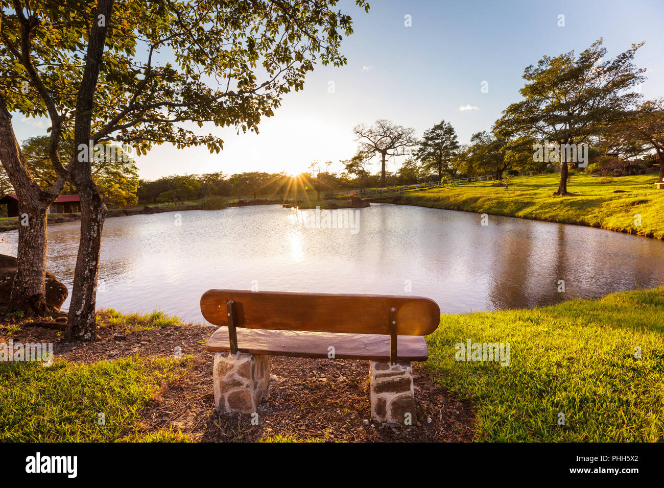 Bench on the lake Stock Photo - Alamy