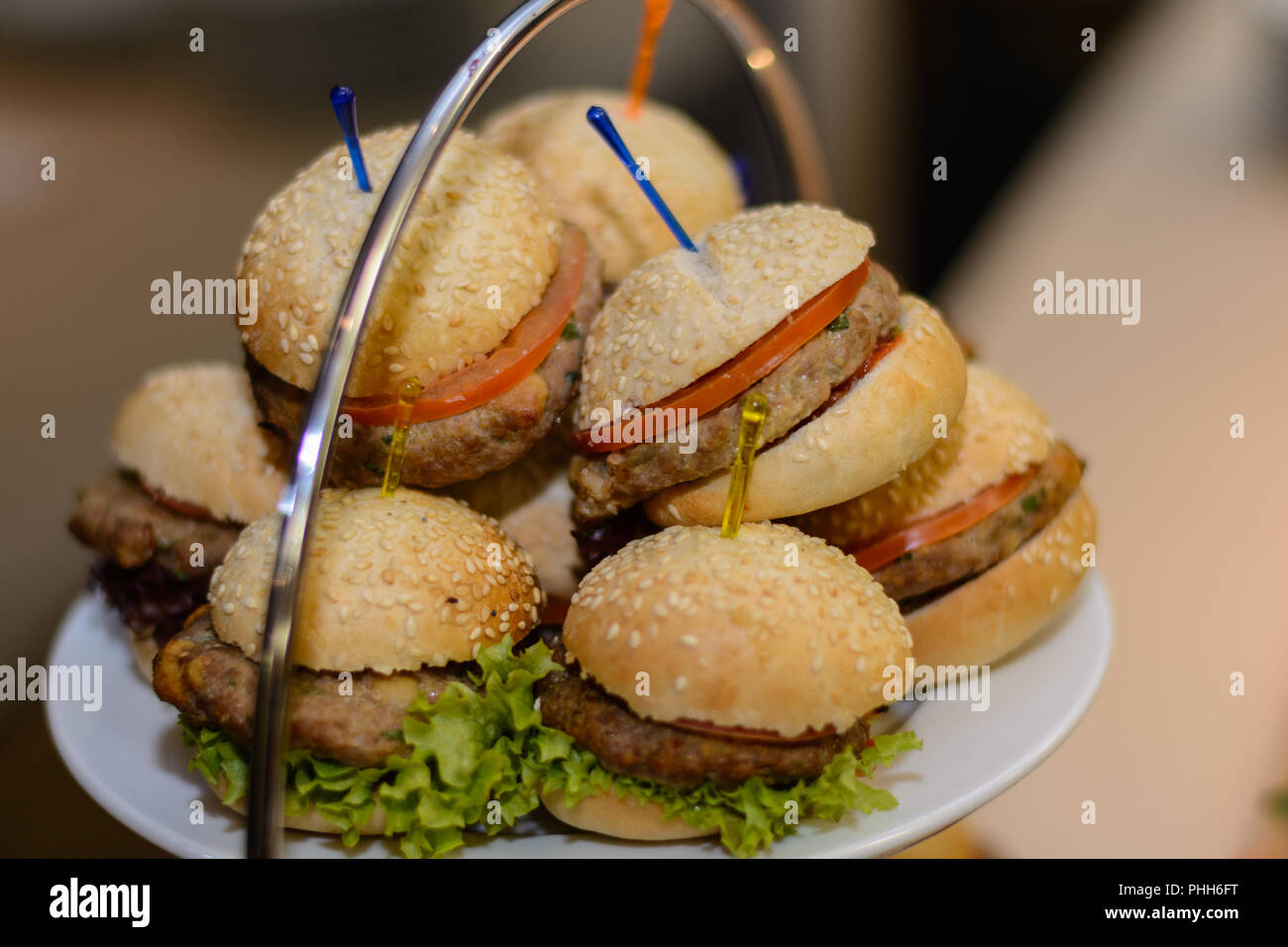 Tray of samples full of little hamburger - close-up Stock Photo - Alamy