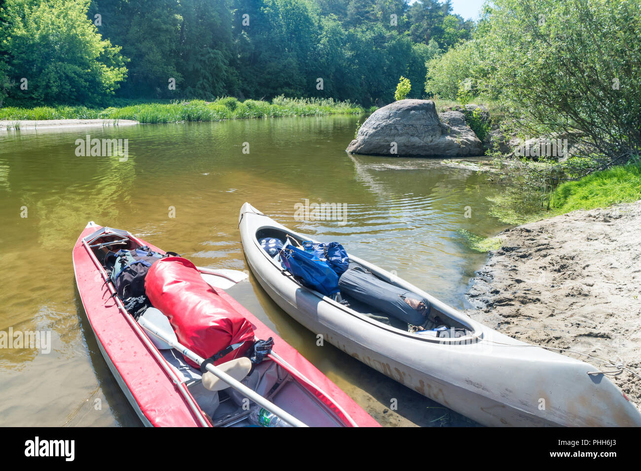 Two kayaks standing in water Stock Photo - Alamy