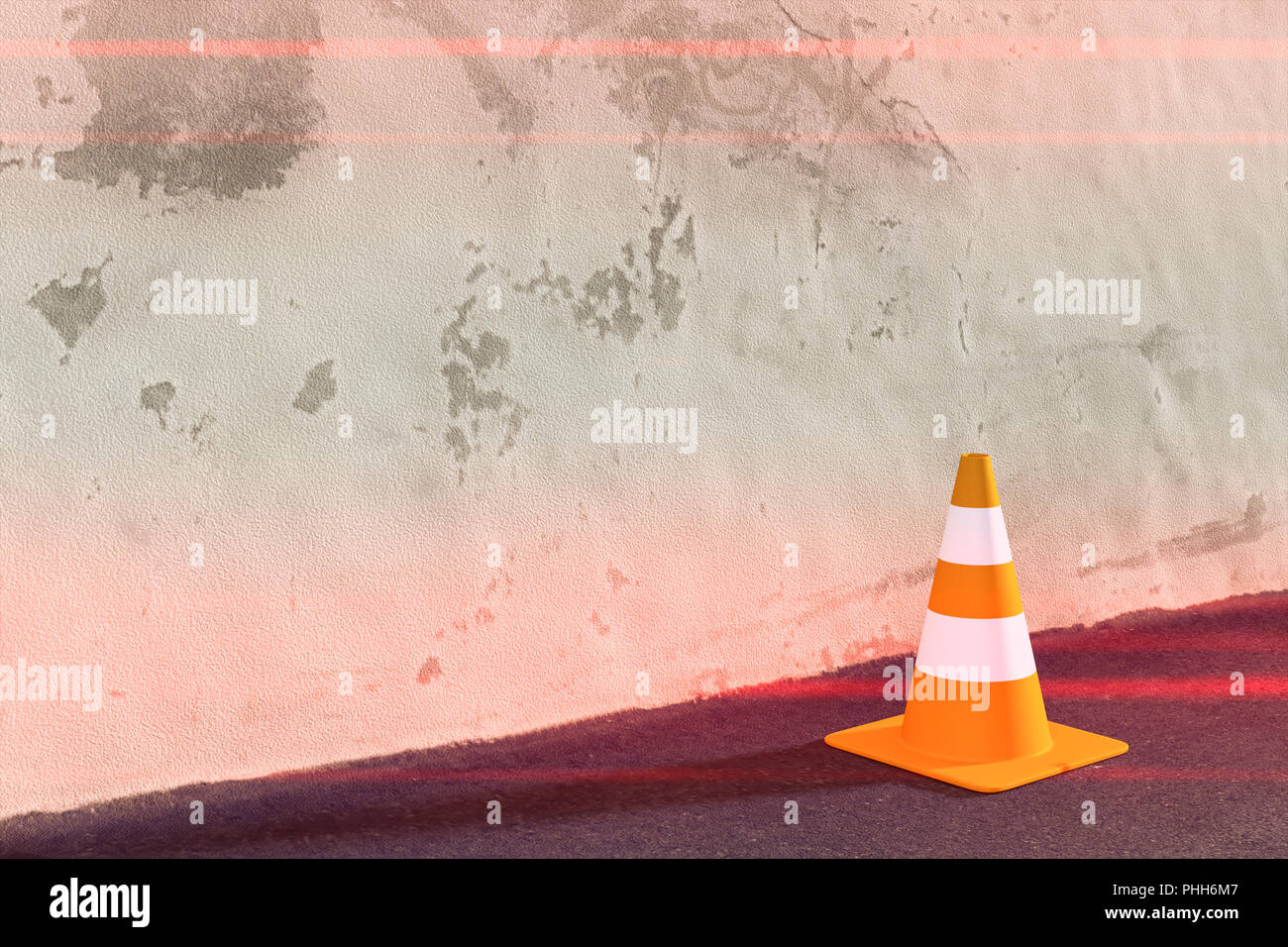 a traffic cone on a wall Stock Photo - Alamy