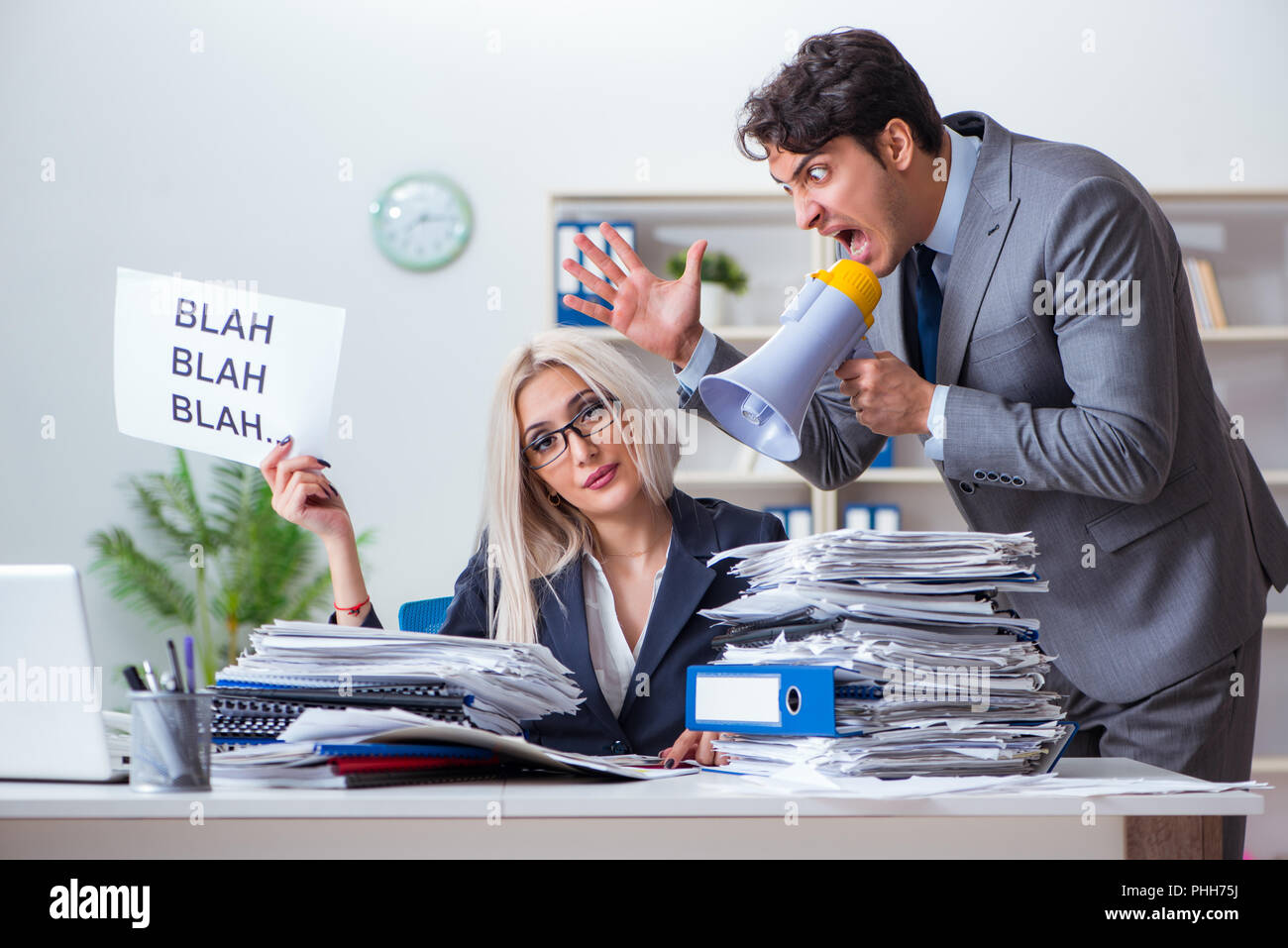 Angry boss yelling at his assistant secretary hi-res stock photography ...