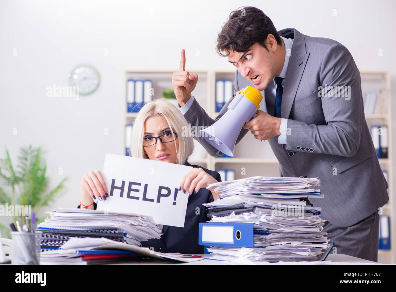 Angry boss yelling at his assistant secretary hi-res stock photography ...