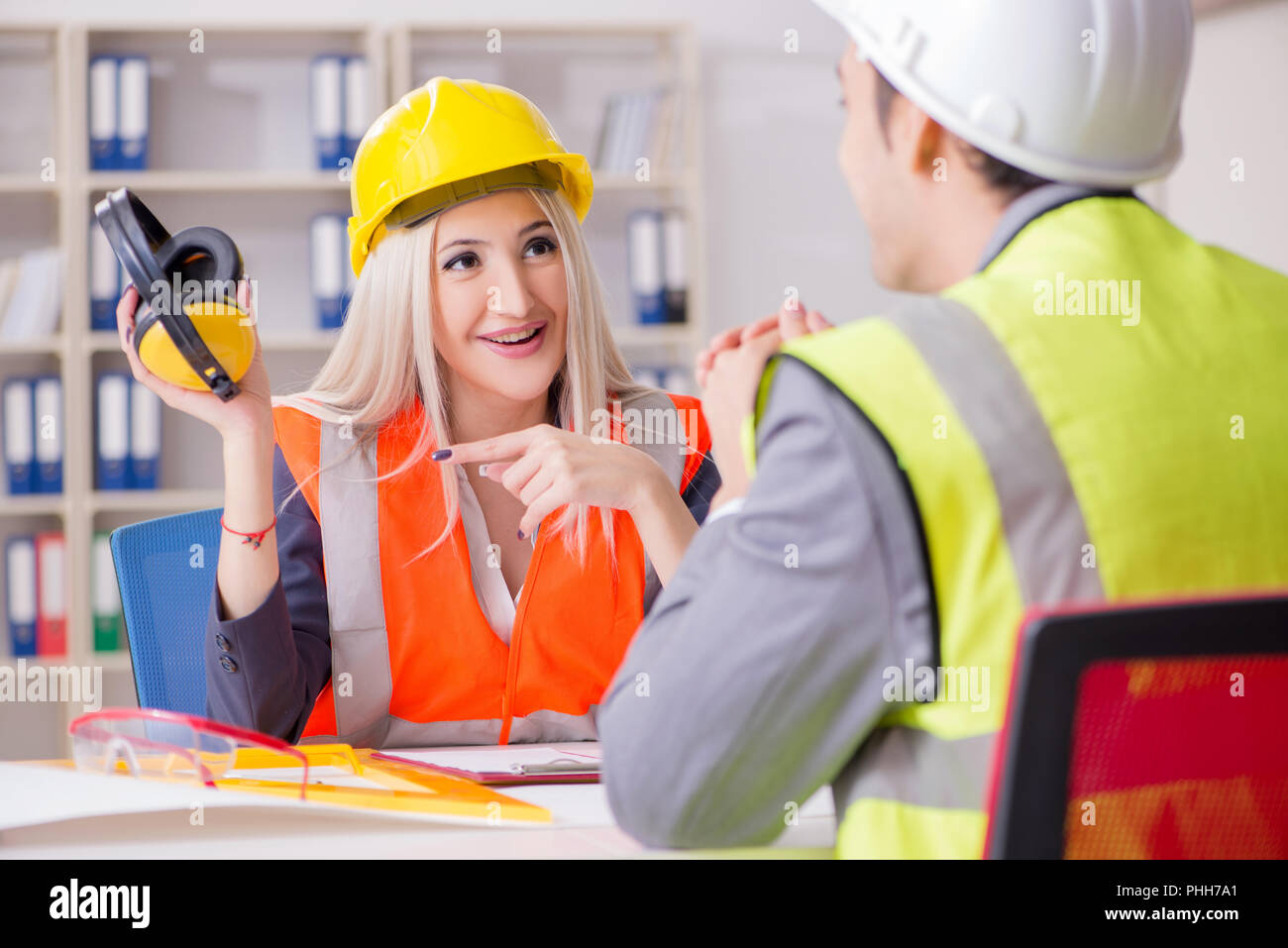 Construction workers having discussion in office before starting Stock ...