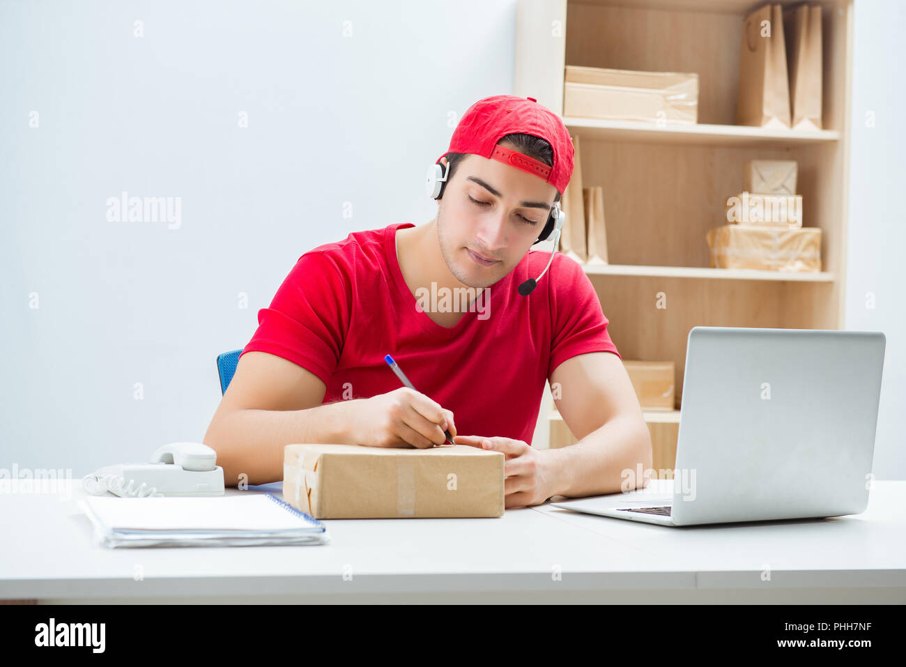 Call center worker at parcel distribution center in post office Stock ...