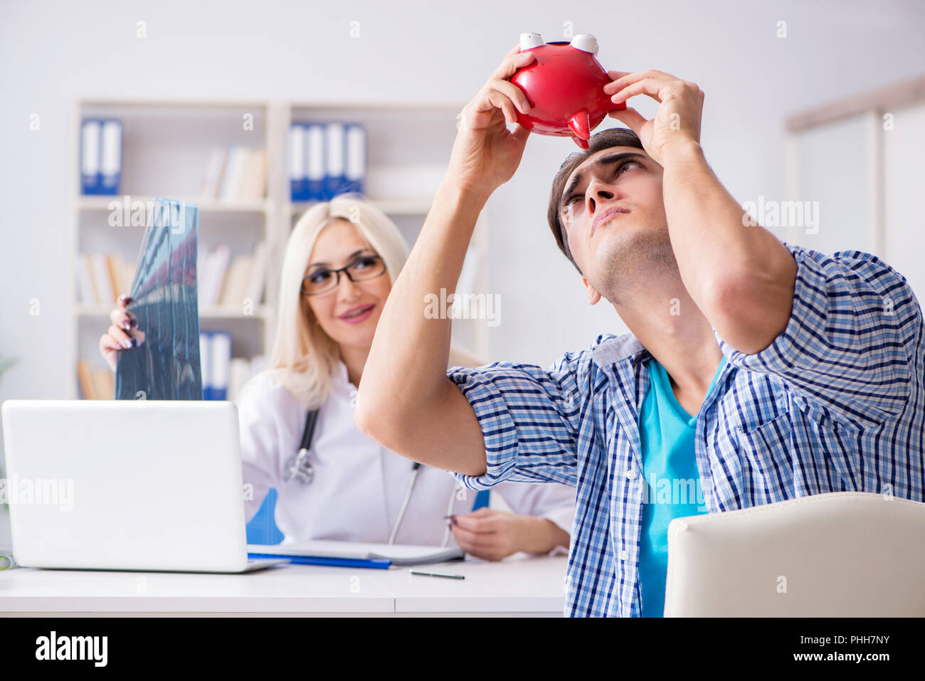 Male patient angry at expensive healthcare bill Stock Photo - Alamy