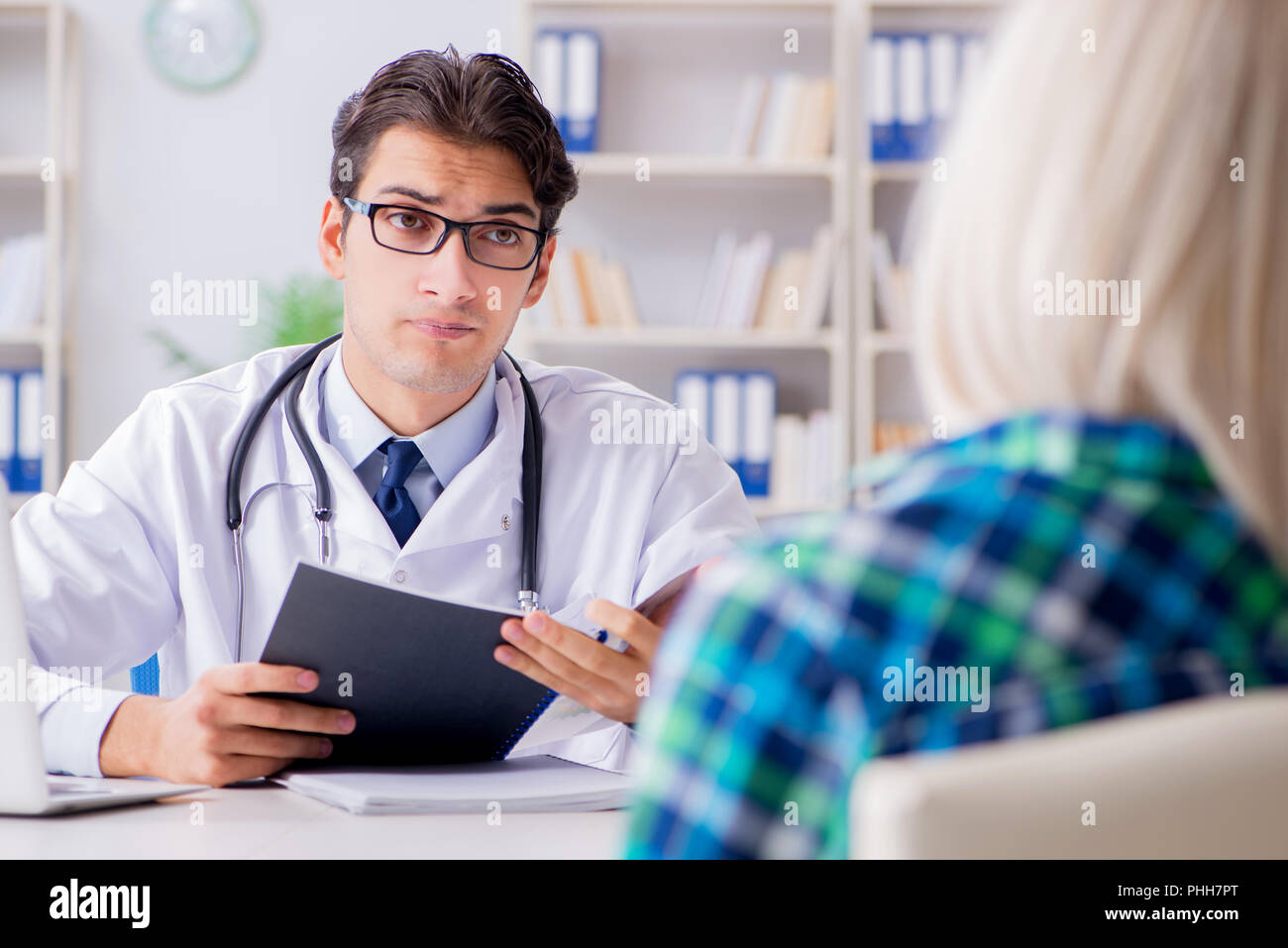 Patient visiting doctor for medical check-up in hospital Stock Photo ...