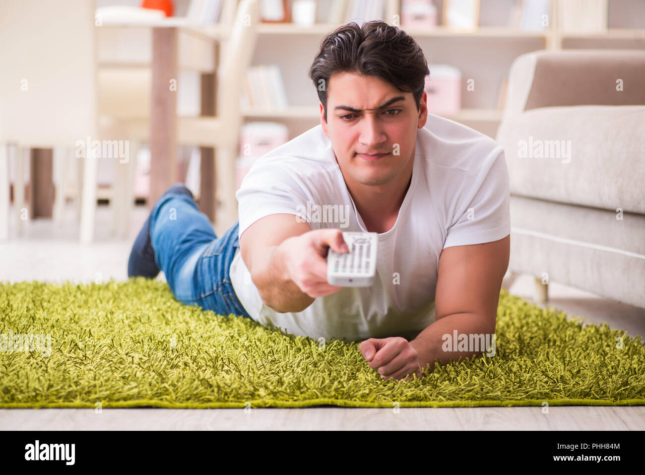 Angry man watching tv on hi-res stock photography and images - Alamy