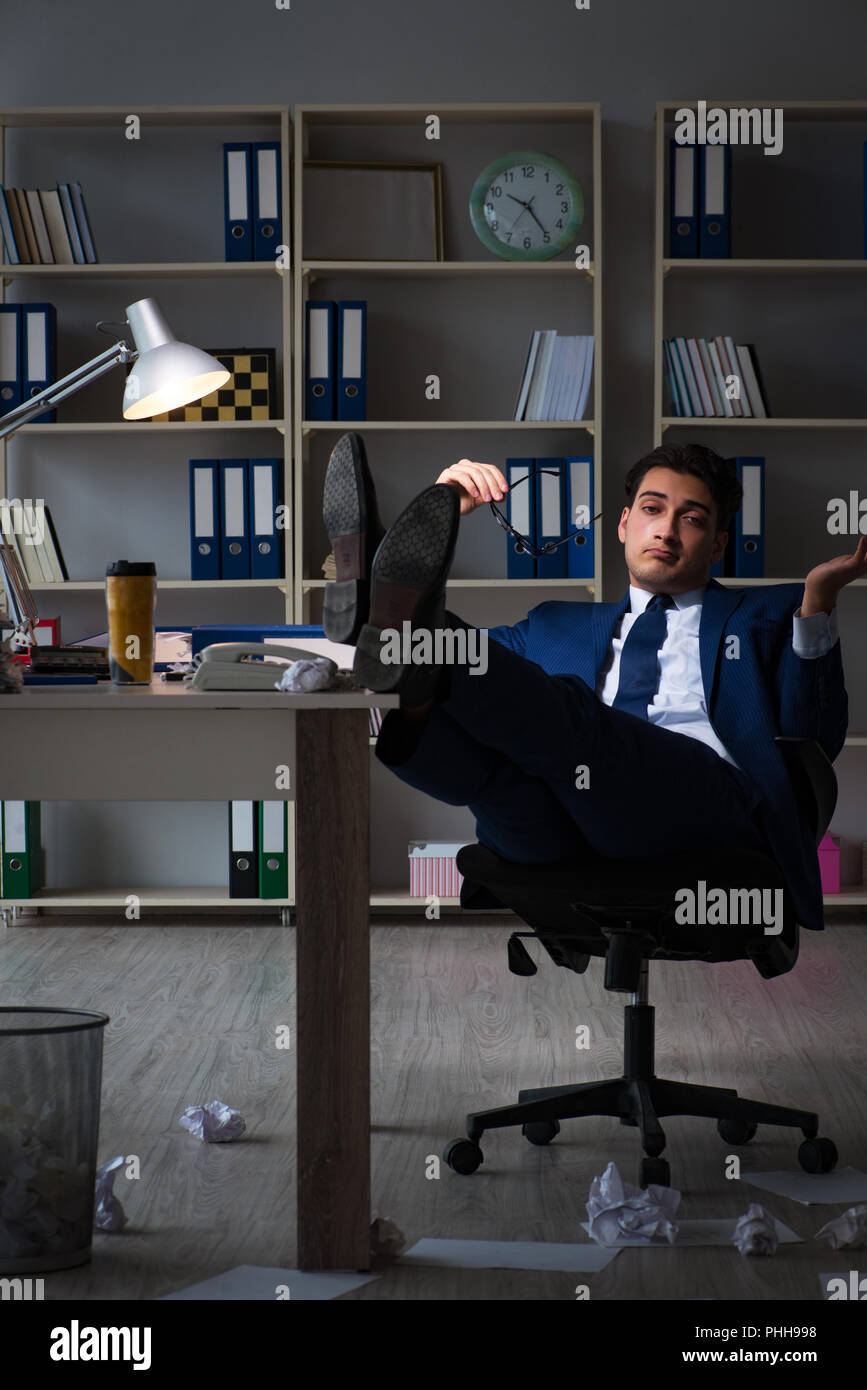 Employee working late to finish important deliverable task Stock Photo ...