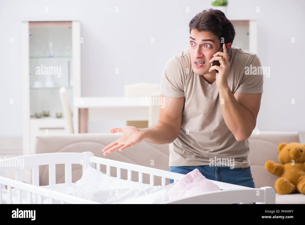 Young father dad frustrated at crying baby Stock Photo - Alamy