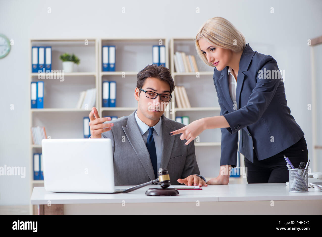 Lawyer discussing legal case with client Stock Photo - Alamy