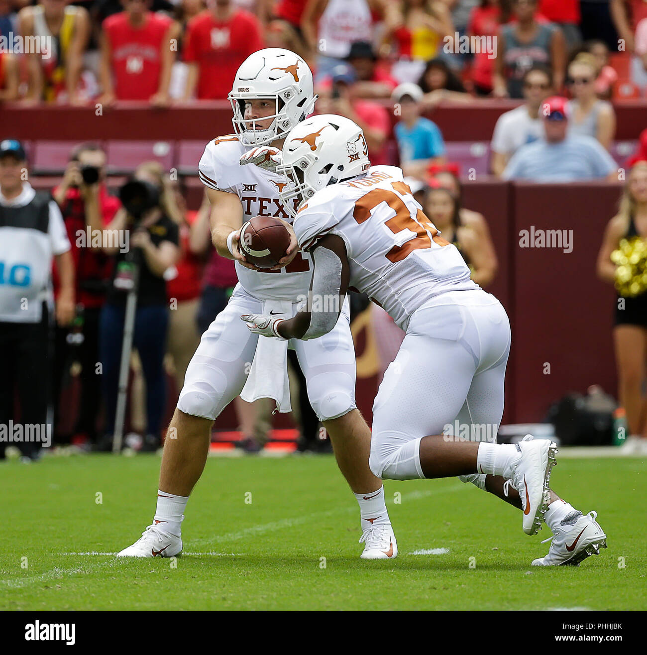 September 1, 2018: Texas Longhorns QB #11 Sam Ehlinger hands the ball ...