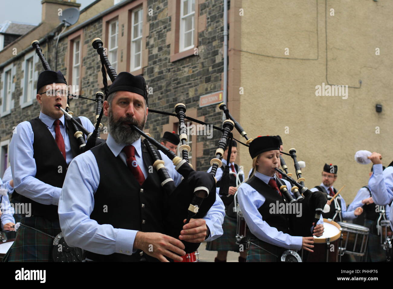 Pipe and Drums Bands Street Parade. Pipers and drummers playing and ...