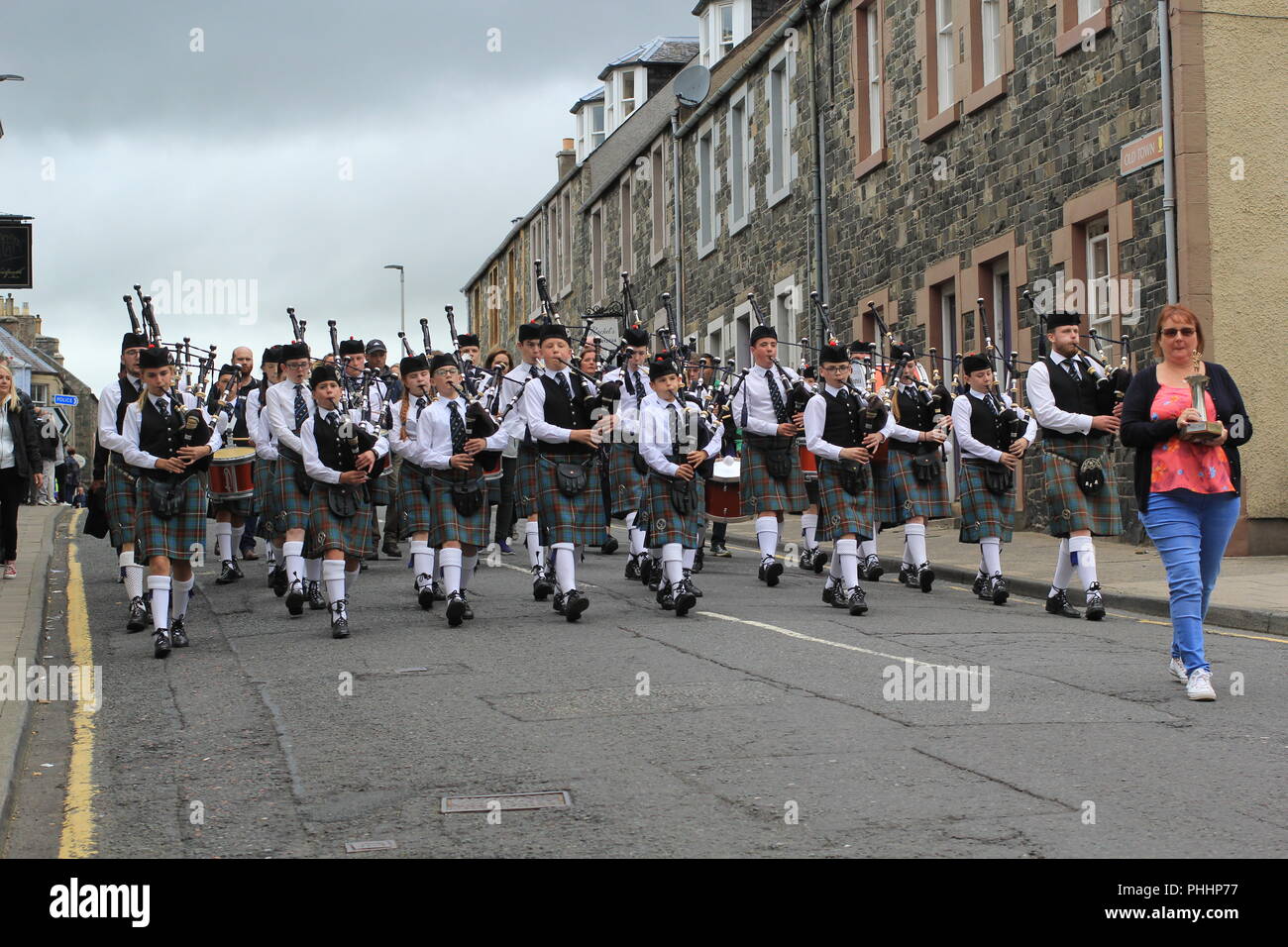 Pipe and Drums Bands Street Parade. Pipers and drummers playing and ...
