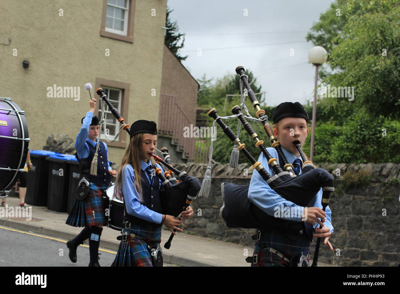 Pipe and Drums Bands Street Parade. Pipers and drummers playing and ...