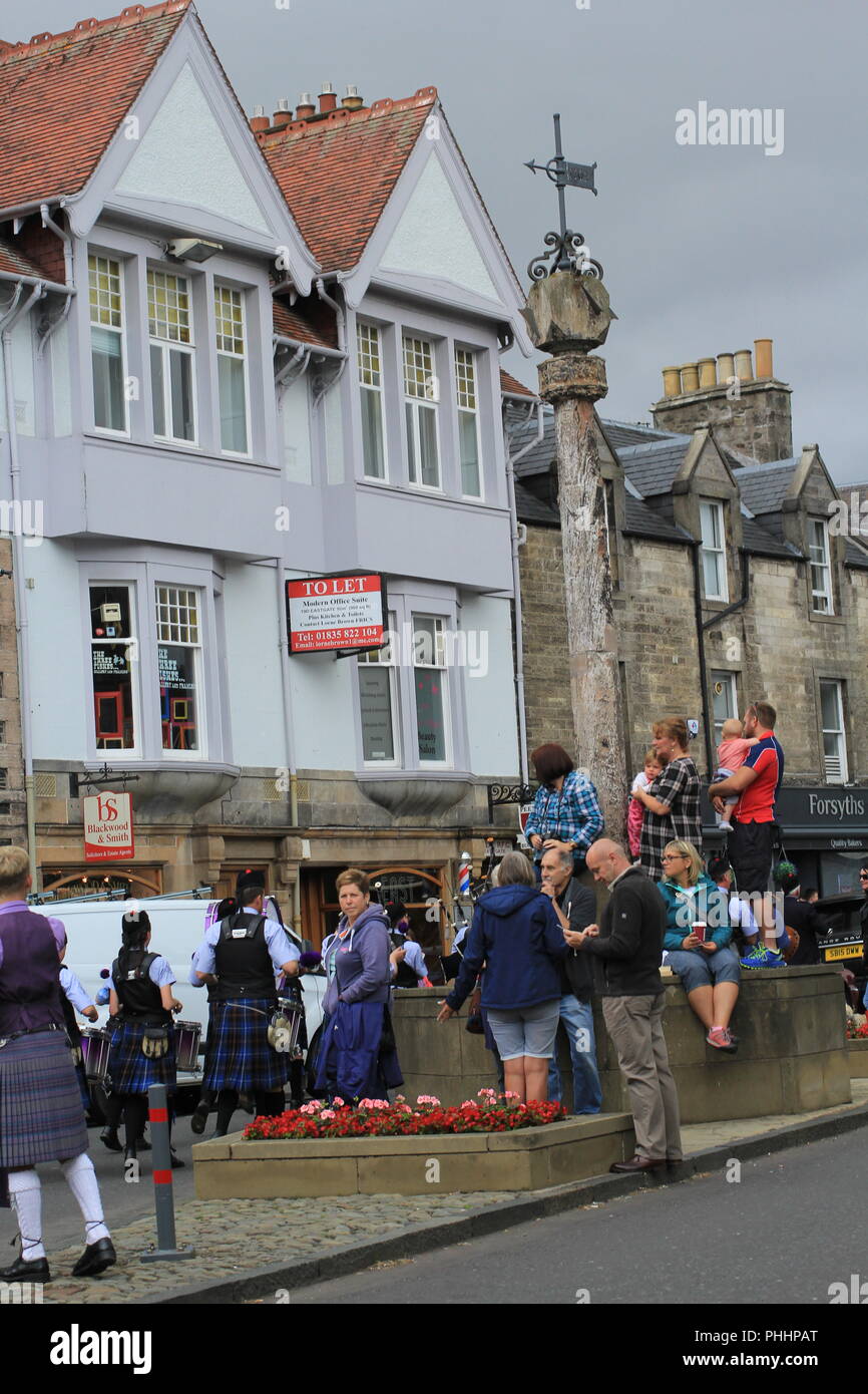 Pipe and Drums Bands Street Parade. Pipers and drummers playing and ...