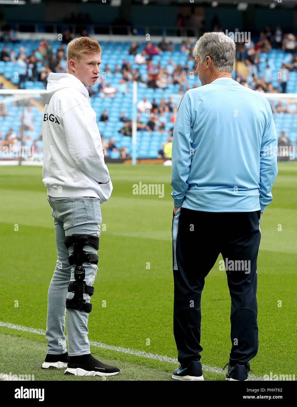 Manchester City's Kevin De Bruyne (left) with co-assistant coach Brian ...