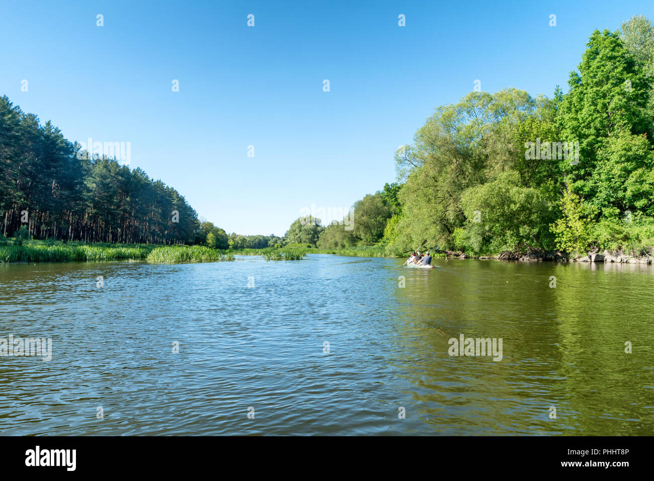 Calm landscape with blue river Stock Photo - Alamy