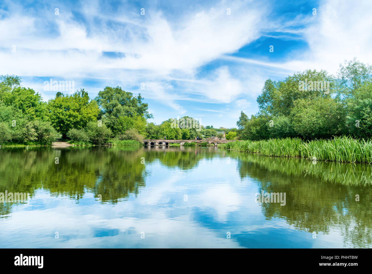 Calm landscape with blue river Stock Photo - Alamy