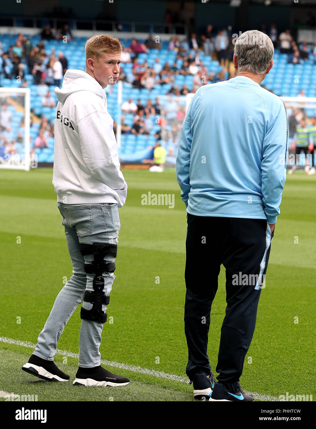 Manchester City's Kevin De Bruyne (left) with co-assistant coach Brian ...