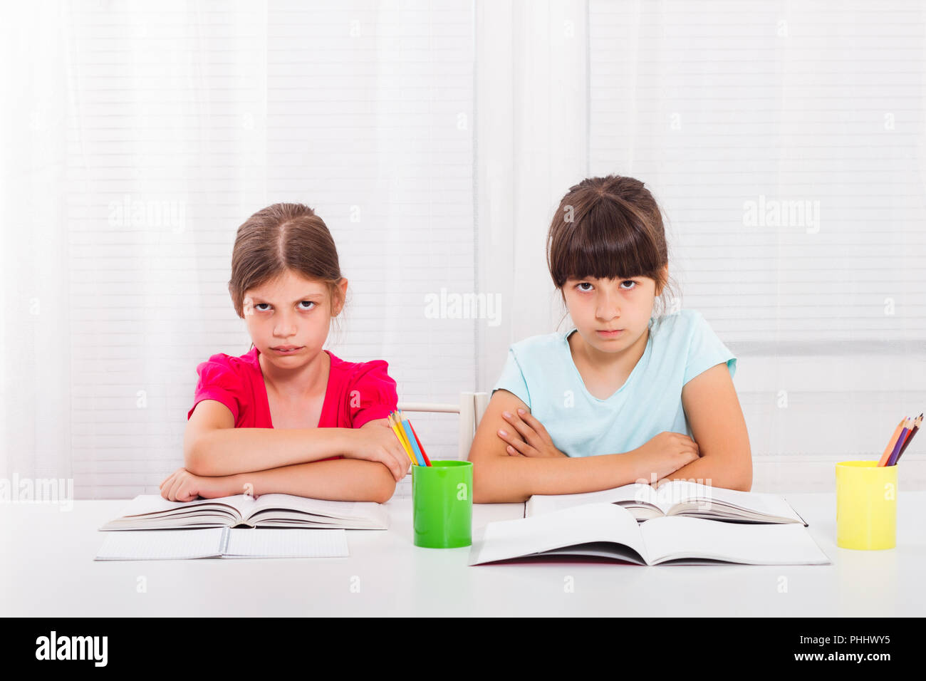 Angry little girls are screaming because they must stay at home and do ...