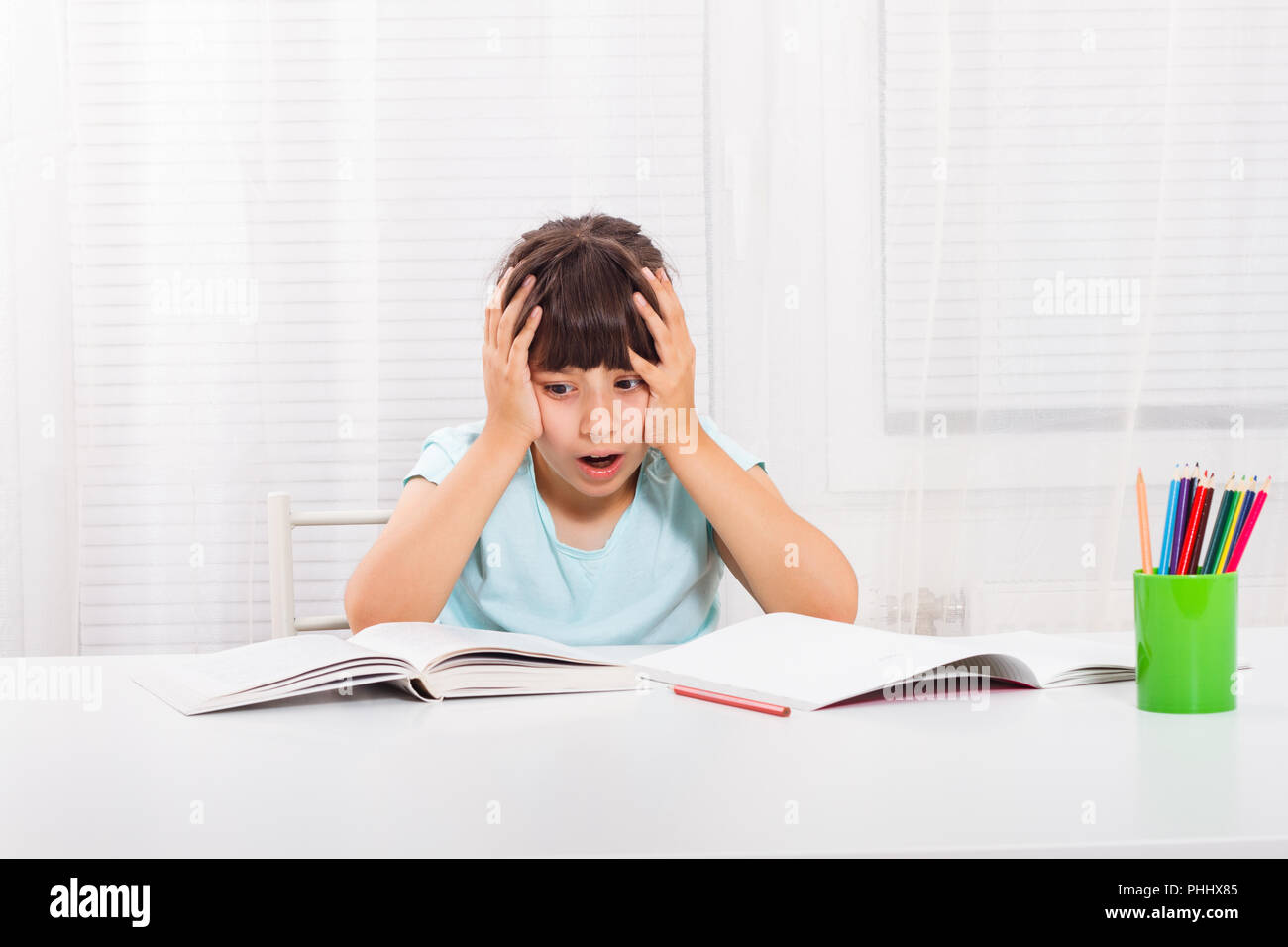 Little girl is in panic because of her homework Stock Photo - Alamy