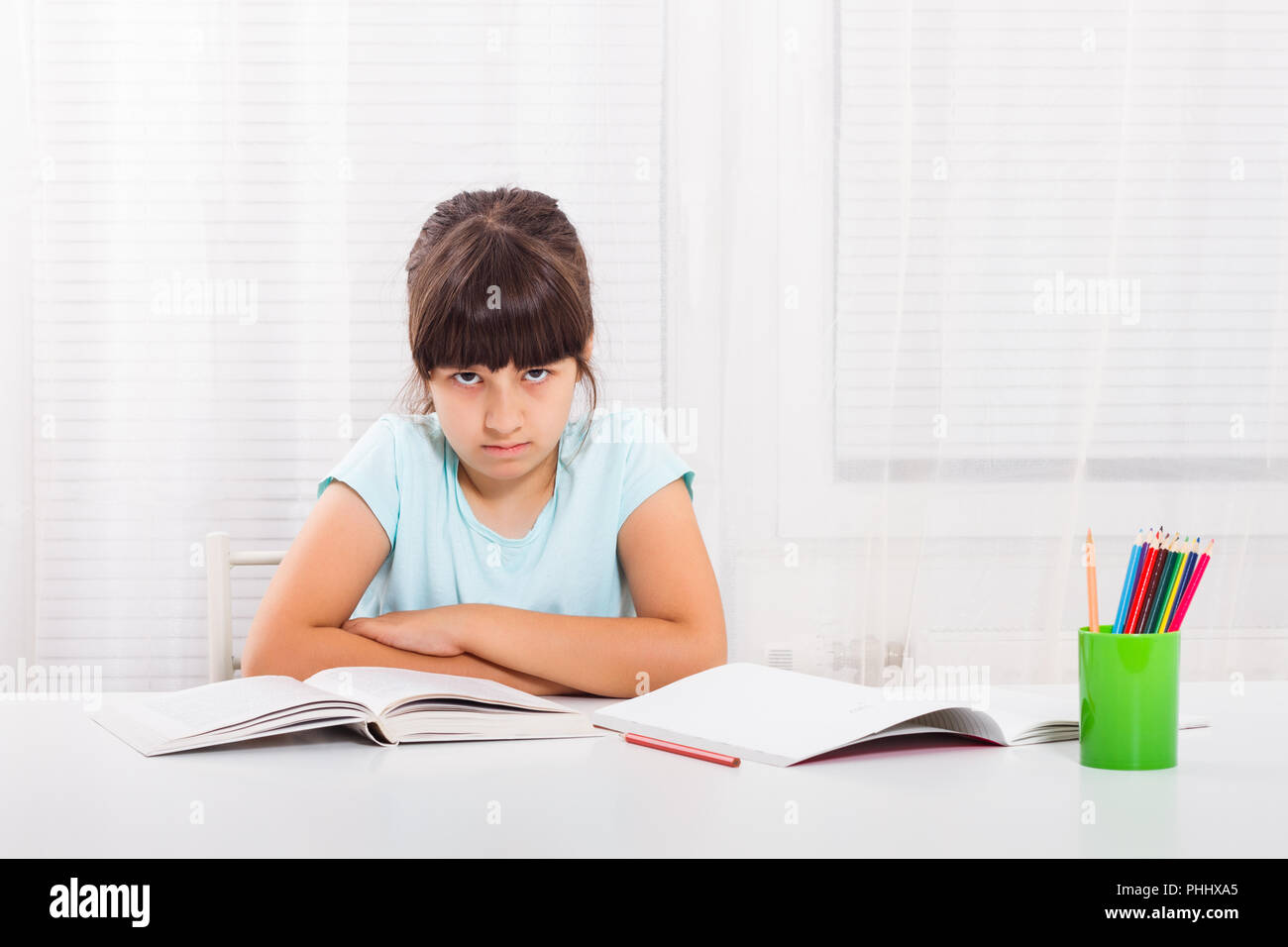 Little girl must stay at home and do her homework,but she would rather ...