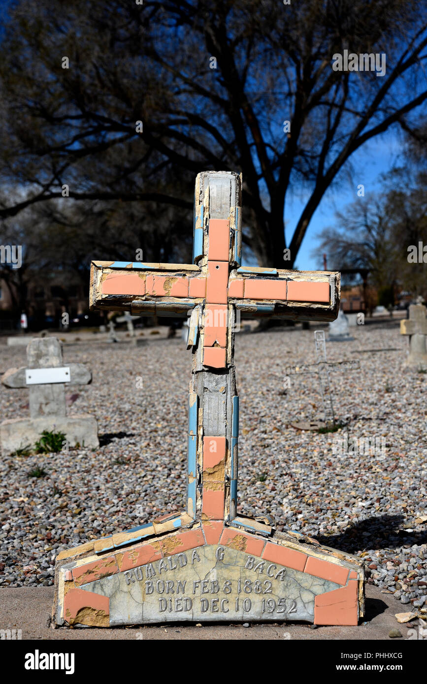 A weathered homemade cross and grave marker in a cemetery in New Mexico ...