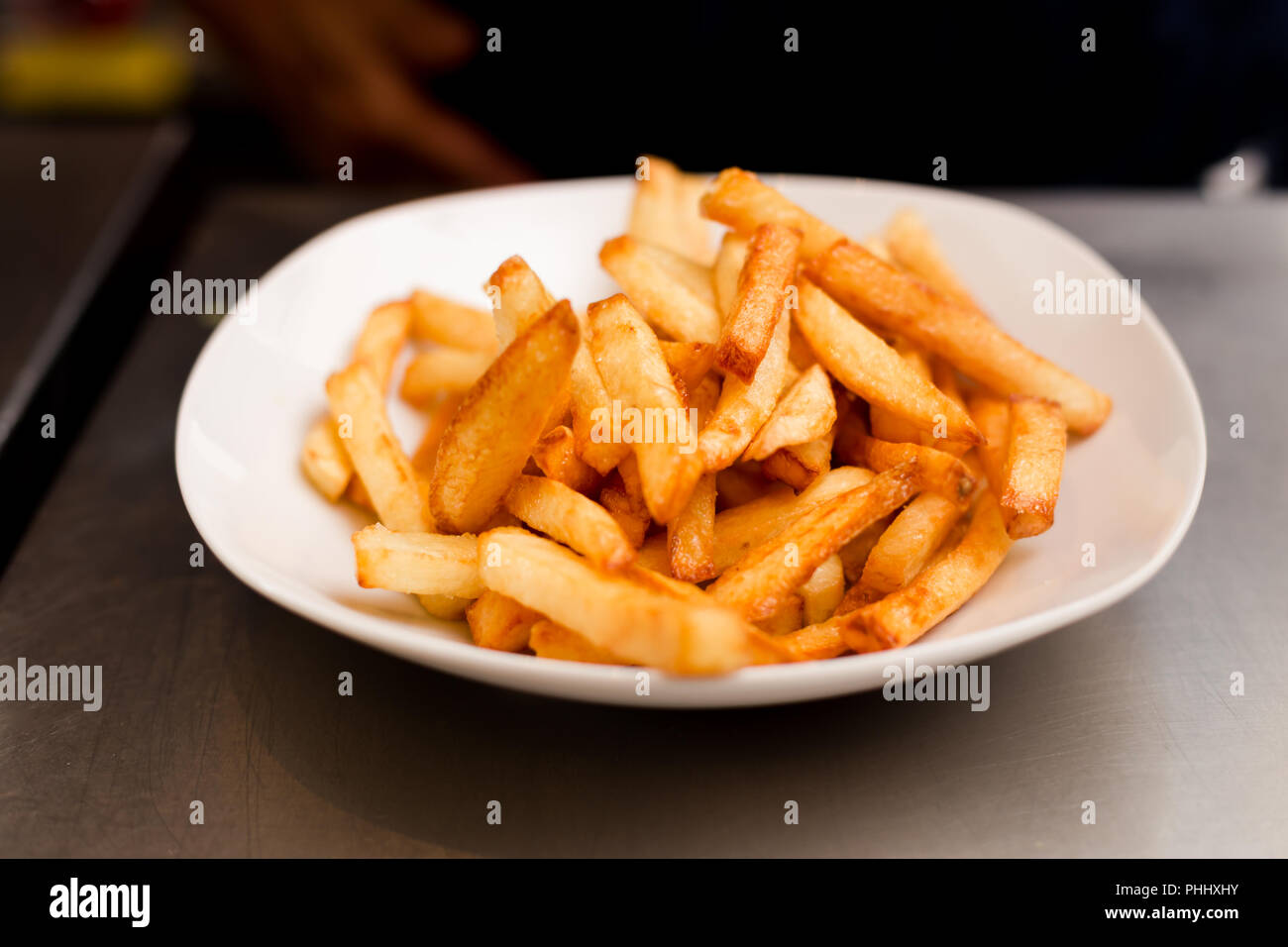 French fries on a plate, isolated on white background Stock Photo - Alamy