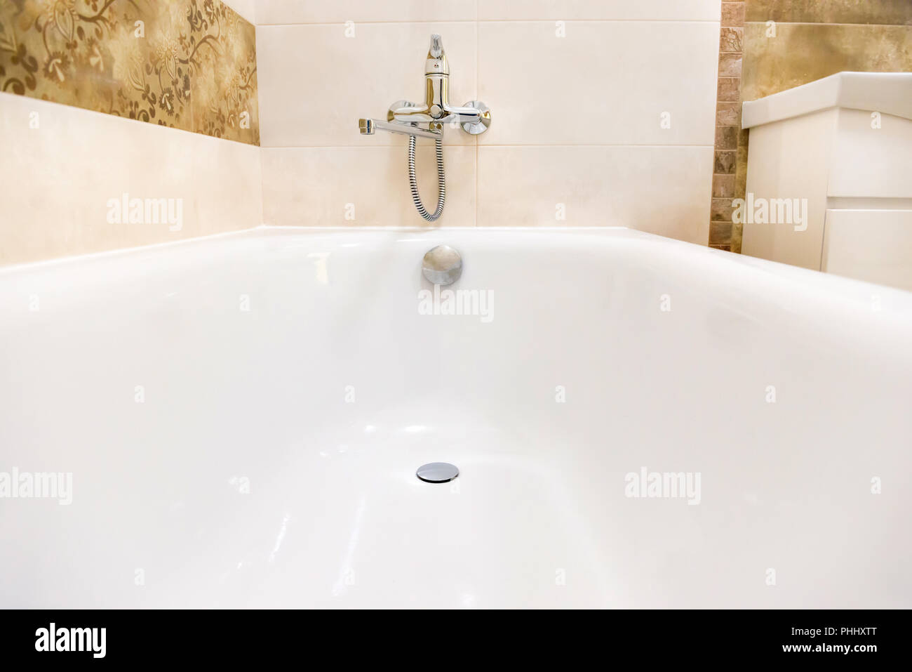 Close up of white bathtub Stock Photo - Alamy