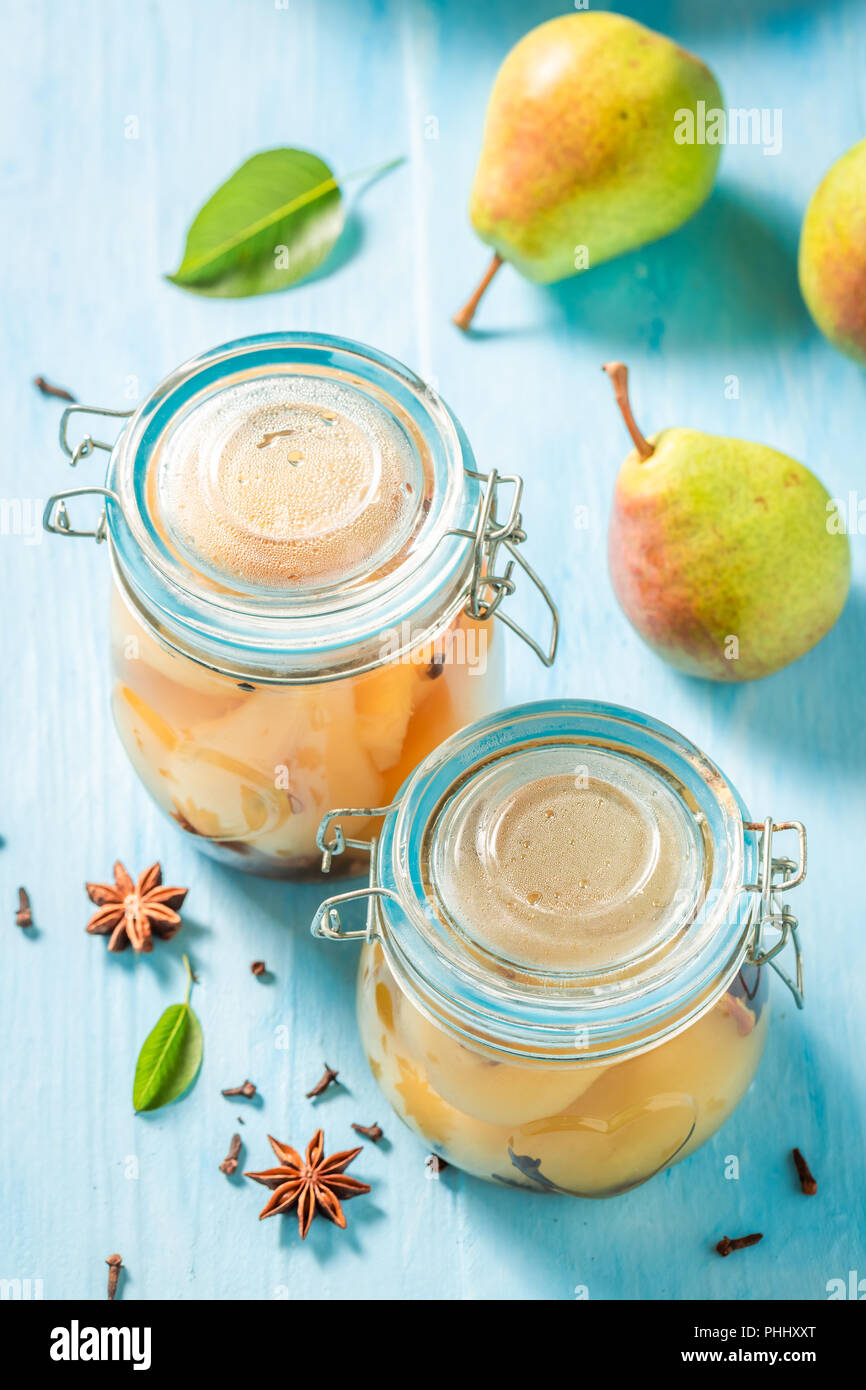 Sweet and tasty pickled pears in the jar Stock Photo - Alamy