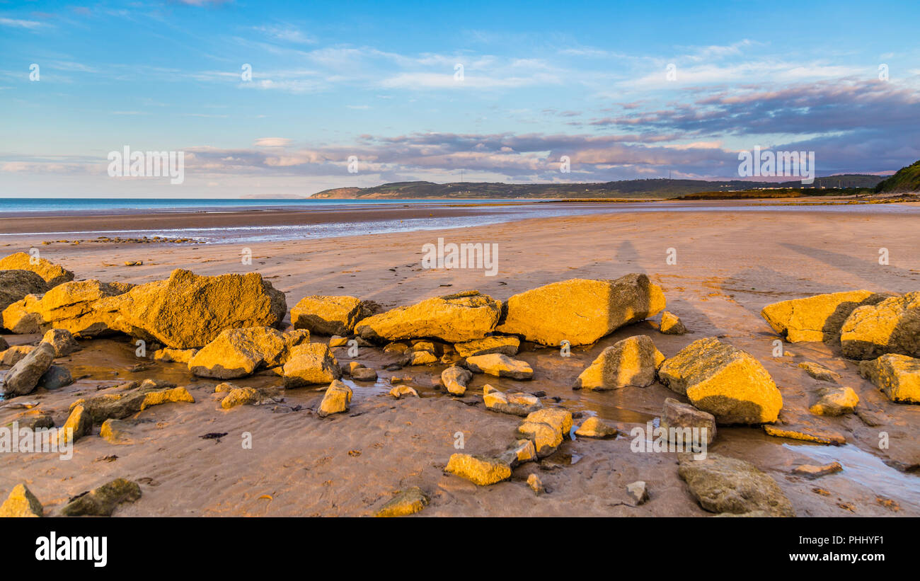 Sunset at the beach, Wales, UK Stock Photo - Alamy