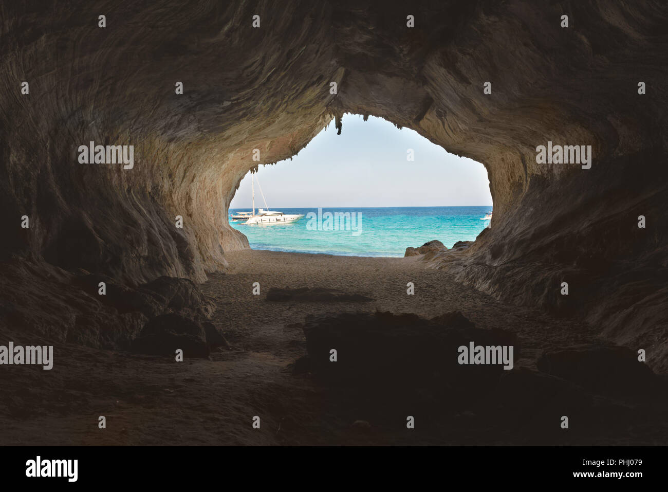 Exit from the big cave Stock Photo - Alamy