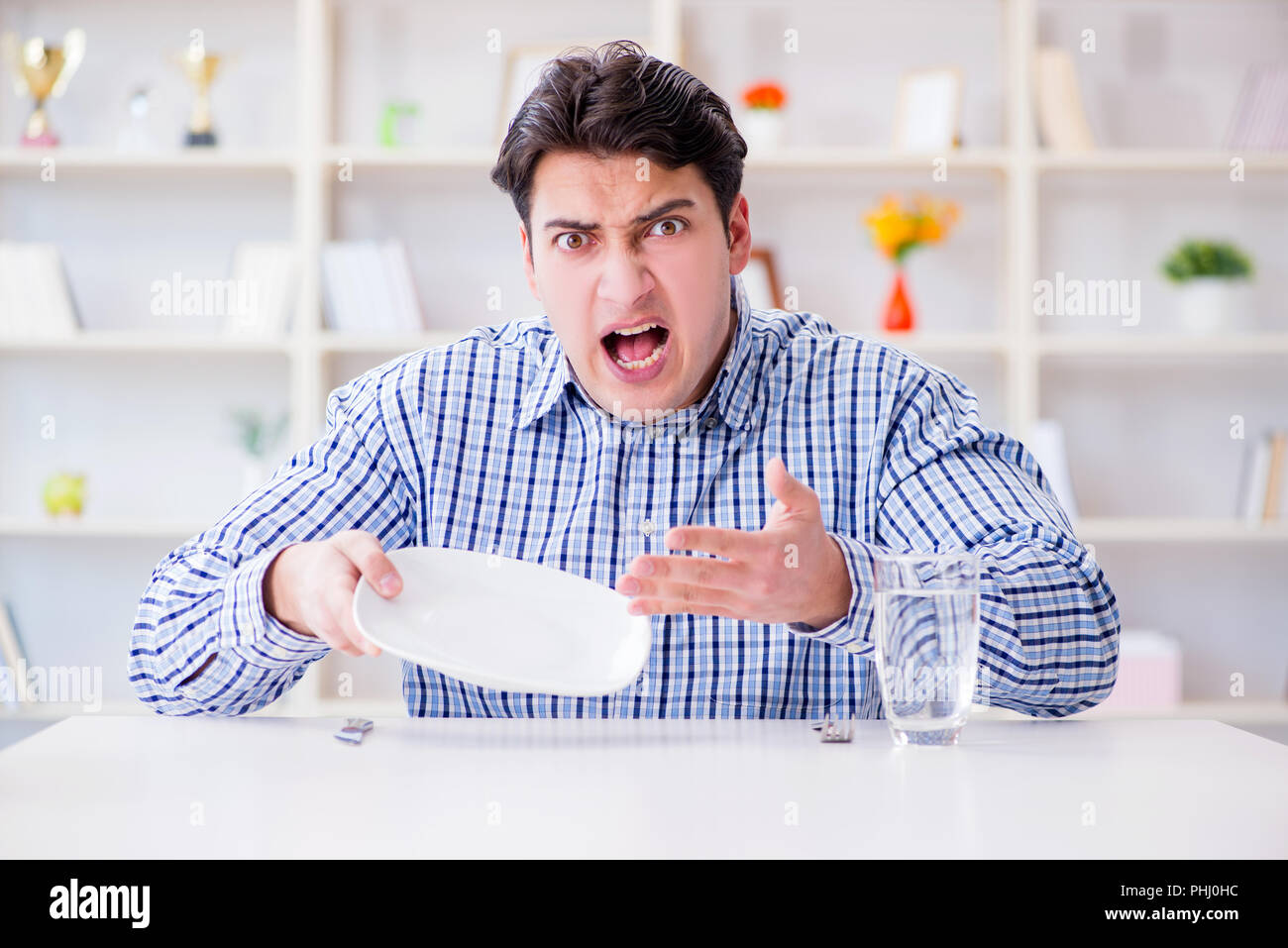 Man on diet waiting for food in restaurant Stock Photo - Alamy