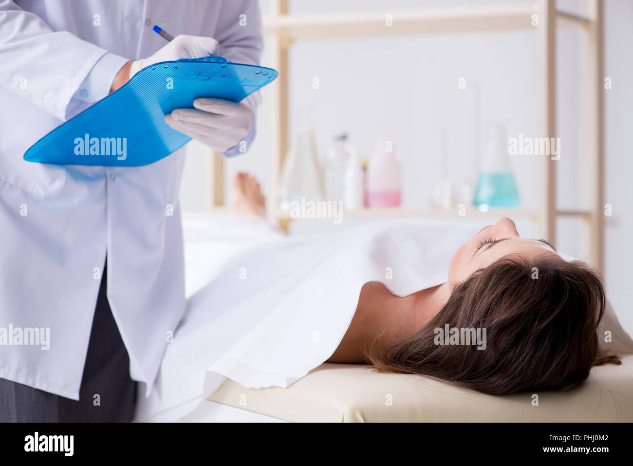 Police coroner examining dead body corpse in morgue Stock Photo - Alamy